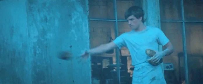 Image - Peeta throwing away burnt bread.jpg | The Hunger Games Wiki ...